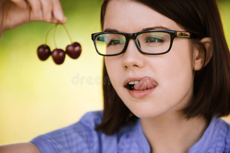Young Pensive Woman Eating Cherries Stock Photo - Image of enjoy ...
