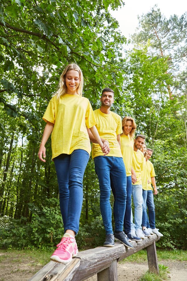 Young People As a Team on the Balance Beam Stock Photo - Image of ...