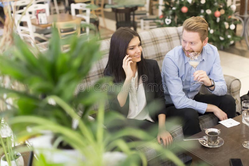 Young people in cafe stock image. Image of communication - 65731145