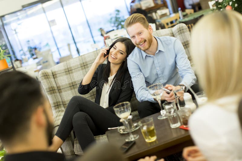 Young people in cafe stock image. Image of lifestyle - 65926759