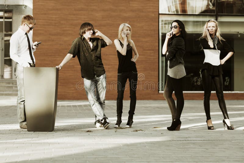Young People Calling on the Phones Stock Photo - Image of female ...