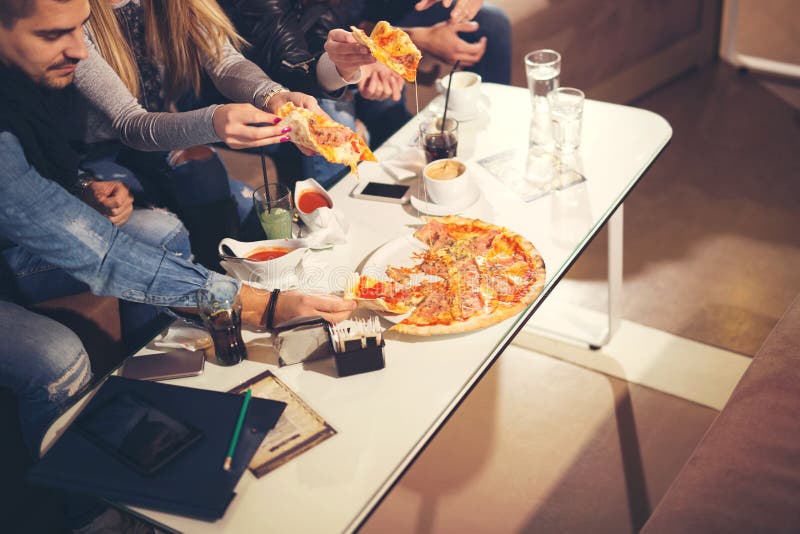 Young People in Casual Clothes Eating Pizza Stock Photo - Image of ...
