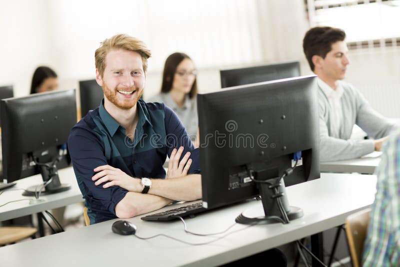 Young People in the Classroom Stock Image - Image of group, adults ...