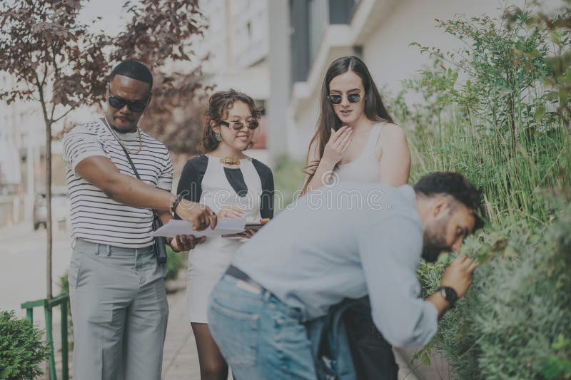 Young People Collaborating Outdoors on Creative Business Project Stock ...