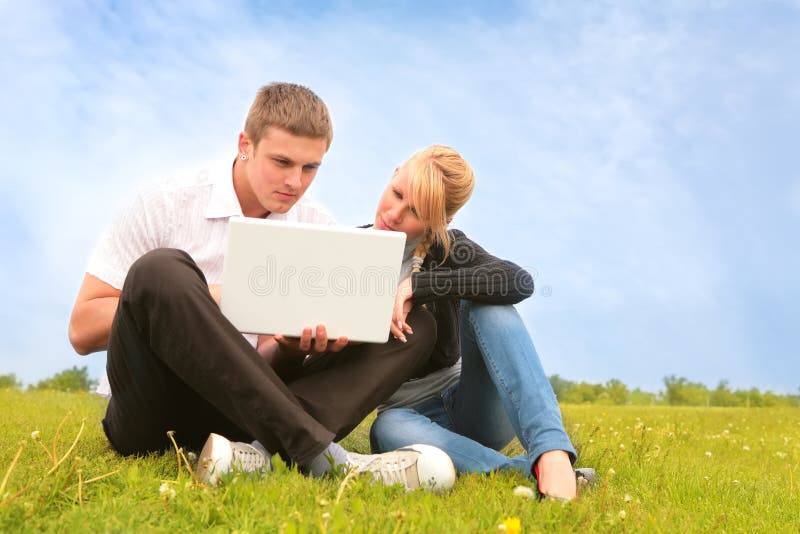 Young people and computer stock photo. Image of green - 7784636