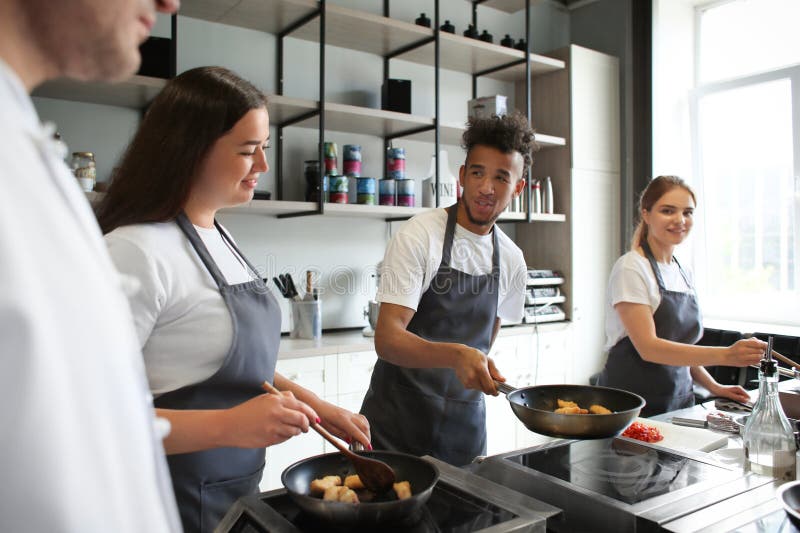 Young People during Cooking Classes in Restaurant Kitchen Stock Photo ...