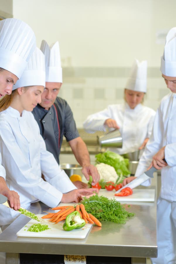 Cooking Course - Senior Male Chef in Cook Uniform Teaches Young People ...