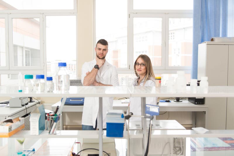 Young People Couple in Bright Modern Lab Stock Image - Image of health ...