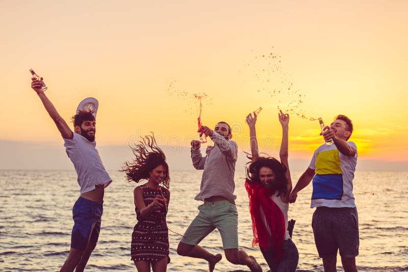 Young People Dancing on Beach at Sunset Stock Photo - Image of freedom ...