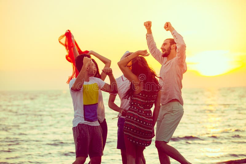 Young People Dancing on Beach at Sunset Stock Image - Image of dancing ...