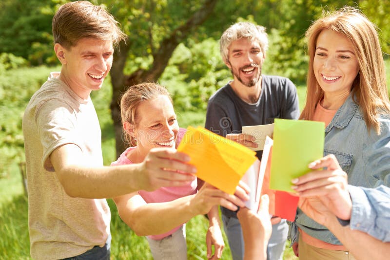 Young People Draw Cards As a Team Training Game Stock Photo - Image of ...