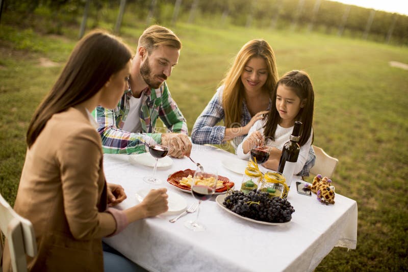 Young People Enjoy Dinner and Wine Tasting in the Vineyard Stock Image ...