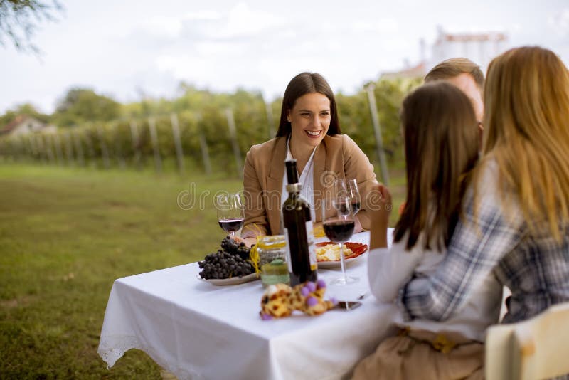 Young People Enjoy Dinner and Wine Tasting in the Vineyard Stock Image ...