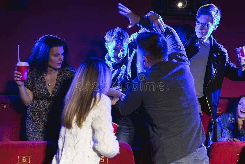 Young People Fight with Each Other in the Cinema. Stock Image - Image ...