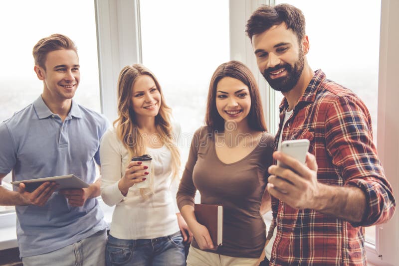 Young people with gadgets stock photo. Image of businessman - 82311366