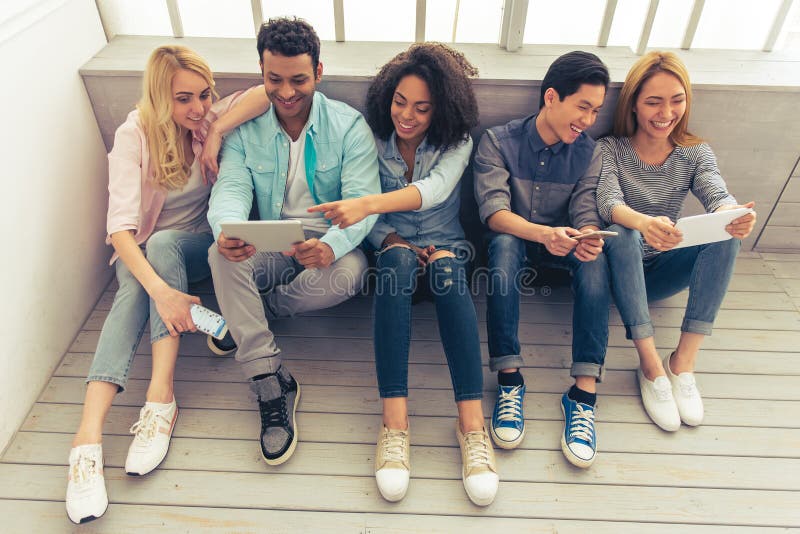 Young people with gadgets stock photo. Image of people - 72211256