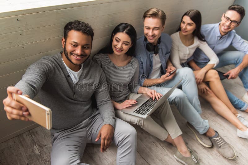 Young people with gadgets stock image. Image of expression - 87473371