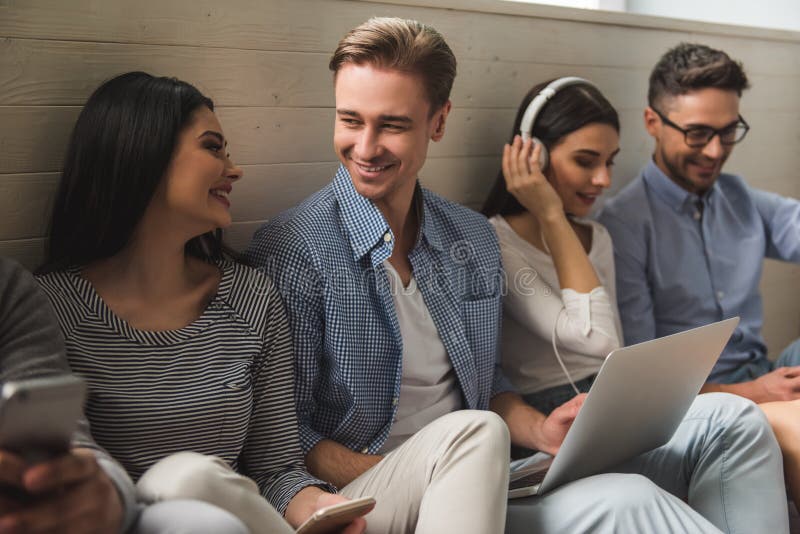 Young people with gadgets stock photo. Image of girl - 87473366