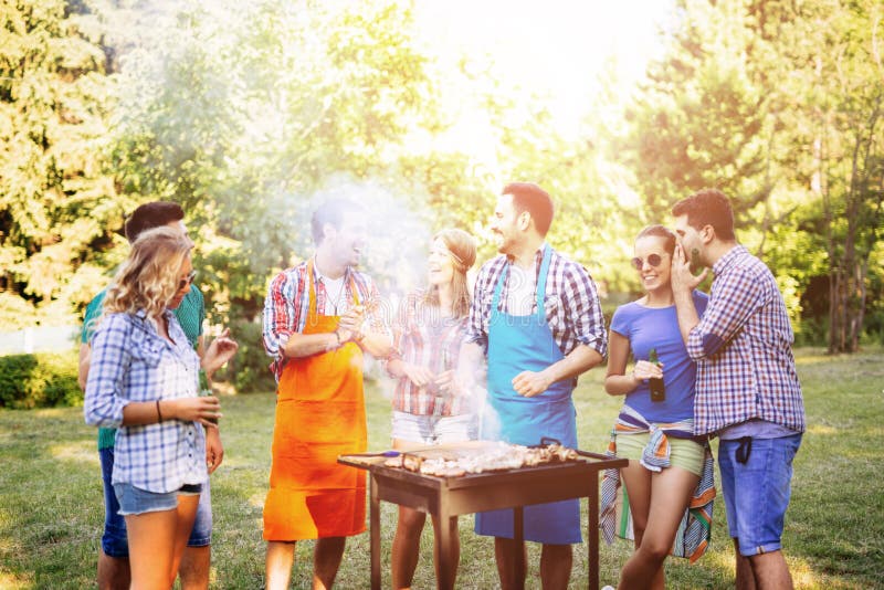 Young People Grilling Outdoors Stock Photo - Image of beef, grilling ...