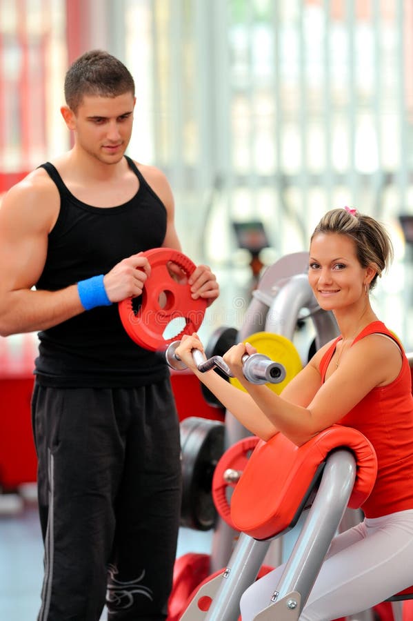 Young people in the gym stock photo. Image of instructor - 12036050