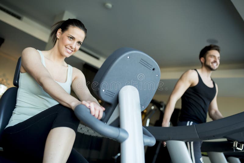 Young people in the gym stock image. Image of female - 59302303