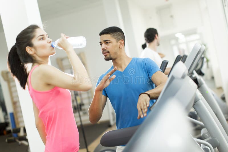 Young people in the gym stock image. Image of women, attractive - 70396543