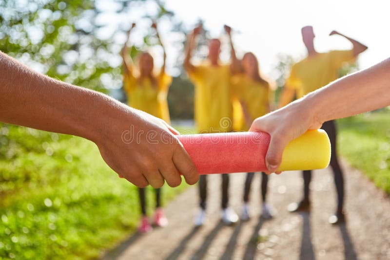 Young People Hand Over a Baton Stock Image - Image of baton, sport ...