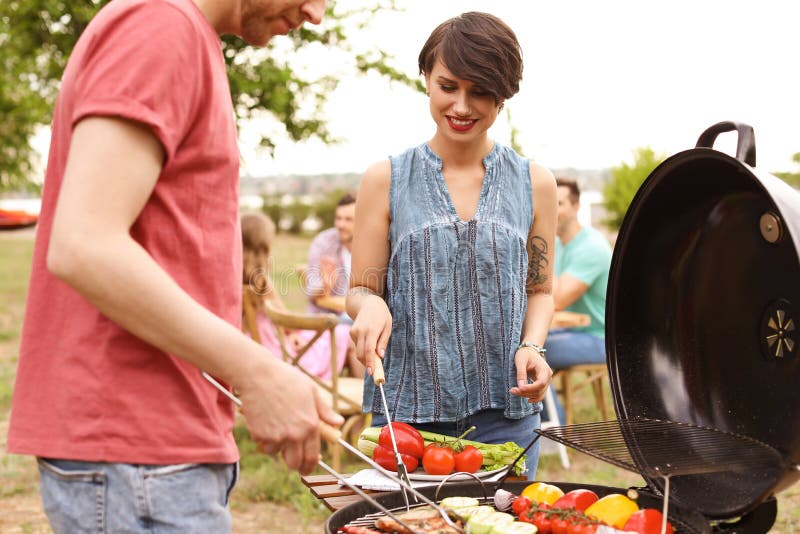 Young People Having Barbecue with Modern Grill Stock Photo - Image of ...