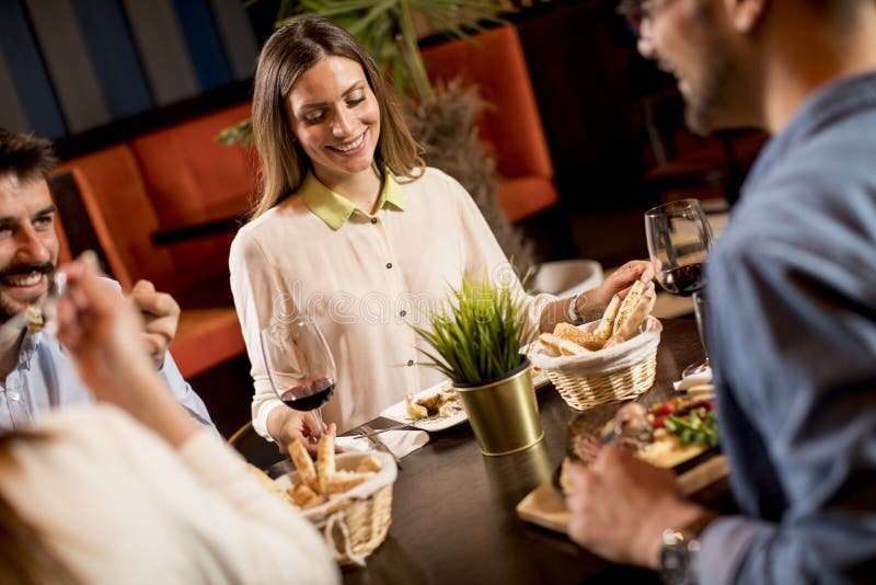 Young People Having Dinner in the Restaurant Stock Photo - Image of ...