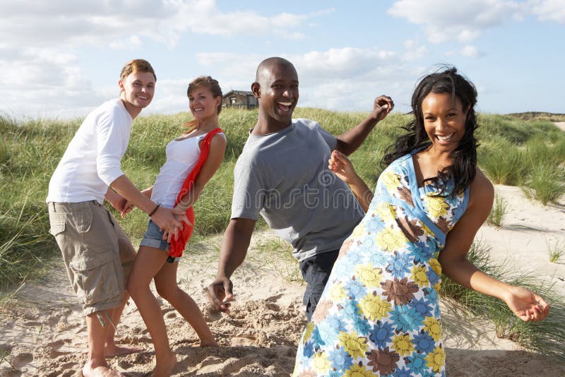 Young People Having Fun Dancing on Beach Stock Photo - Image of smiling ...