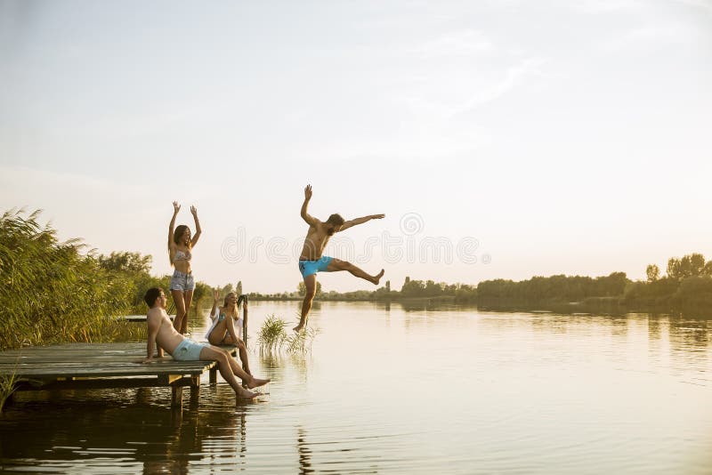 Young People Having Fun at the Lake on a Summer Day Stock Image - Image ...