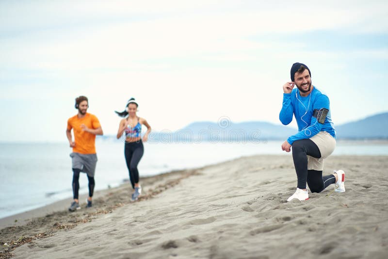 Young People Having Training on the Beach Stock Photo - Image of ...