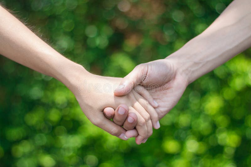 Young people hold hands stock image. Image of lovers - 91734727
