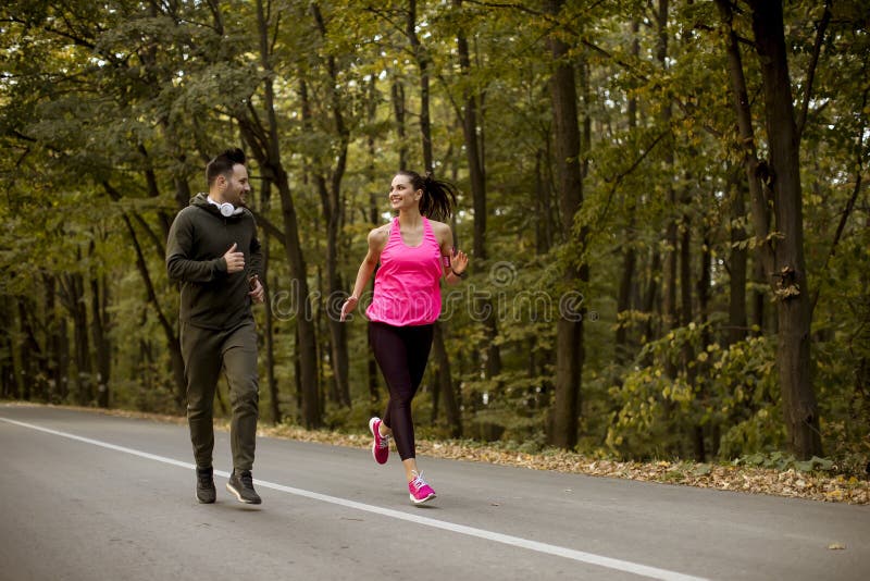 Young People Jogging and Exercising in Nature Stock Photo - Image of ...