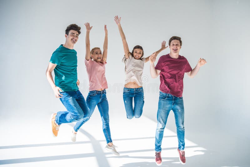 Young People Jumping Together Stock Photo - Image of together, people ...