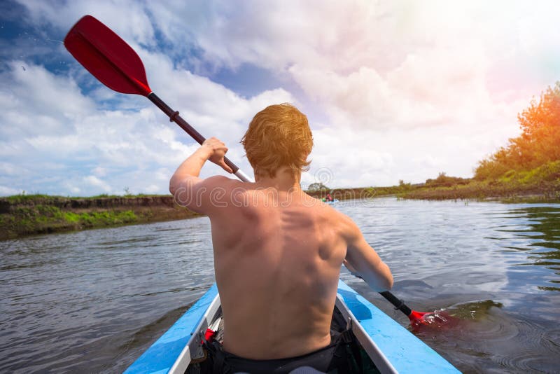 Young People are Kayaking on a River in Beautiful Nature Stock Image ...