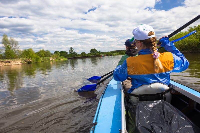 Young People are Kayaking on a River in Beautiful Nature. Summer Sunny ...