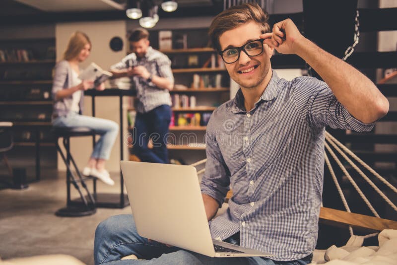 Young People in the Library Stock Image - Image of caucasian, browsing ...