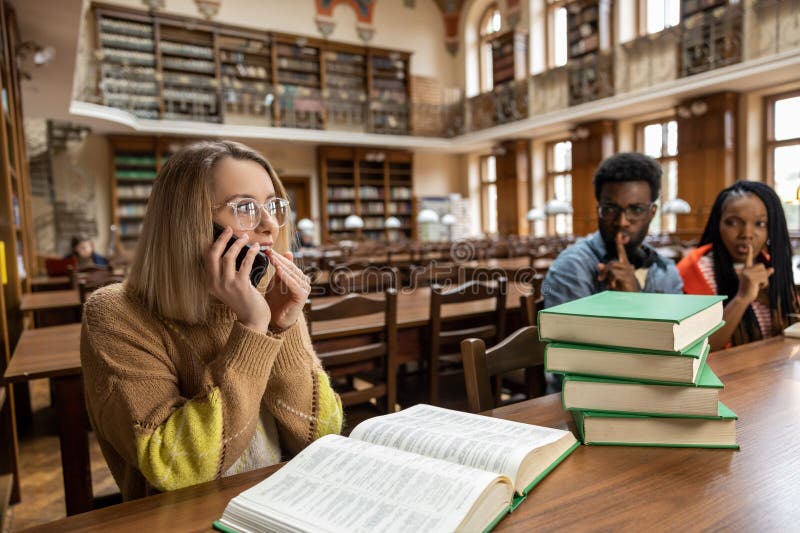 Young People in the Library, Blonde Woman Talking on the Phone Stock ...