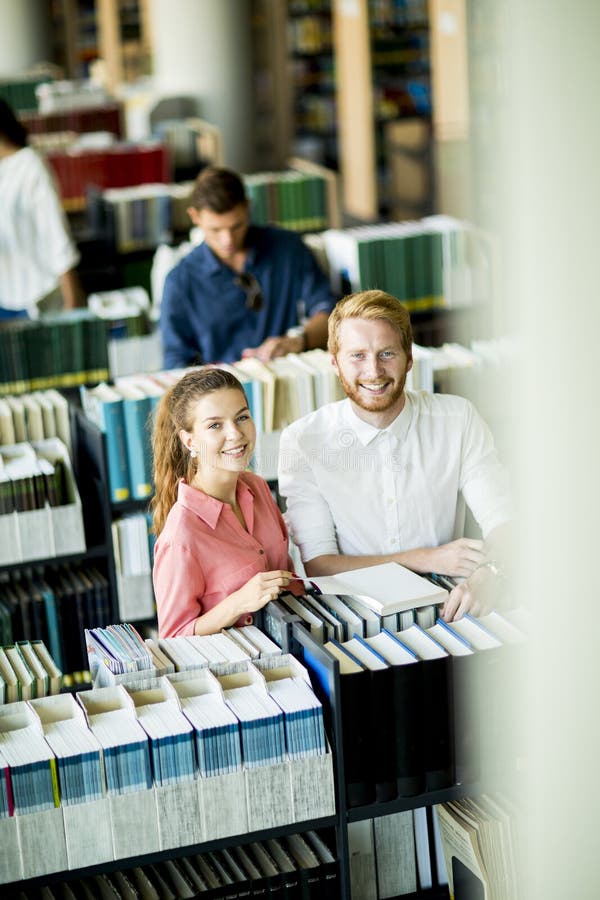 Young People in the Library Stock Photo - Image of study, redhair: 59292516