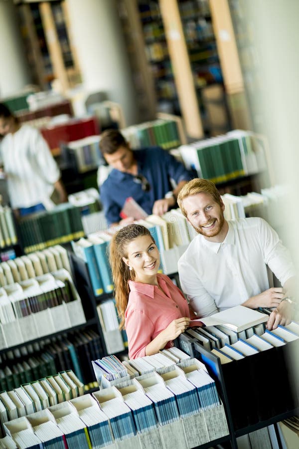 Young People in the Library Stock Photo - Image of bookshelf ...