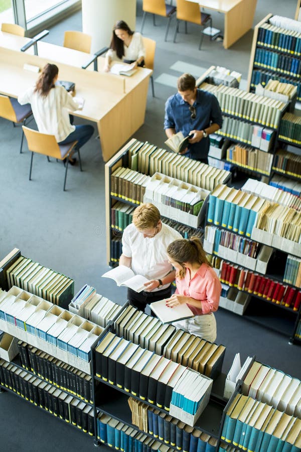 Young People in the Library Stock Photo - Image of young, reading: 60929936