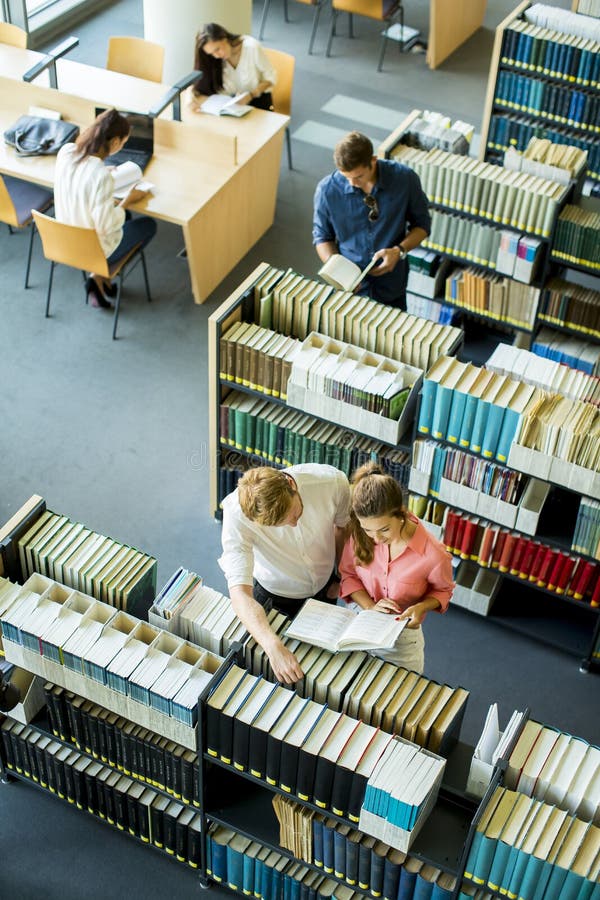 Young People in the Library Stock Image - Image of bookcase, library ...