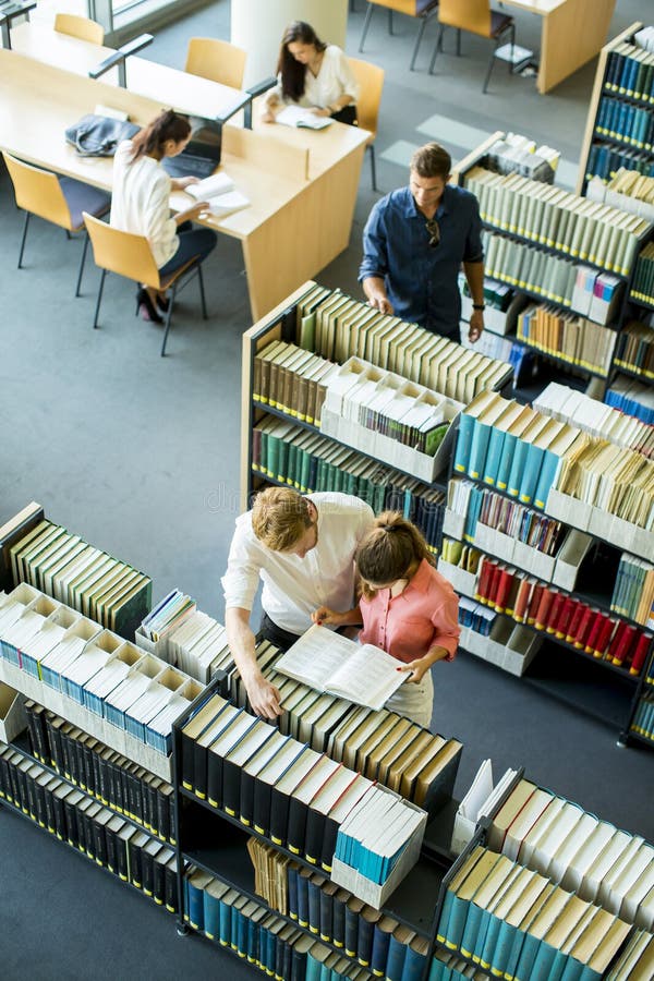 Young People in the Library Stock Photo - Image of female, standing ...
