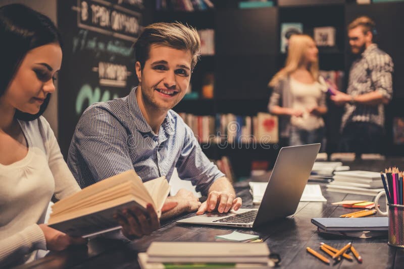 Young People in the Library Stock Image - Image of gadget, female: 85175045