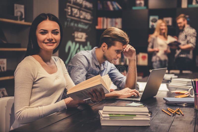 Young People in the Library Stock Image - Image of caucasian, lifestyle ...
