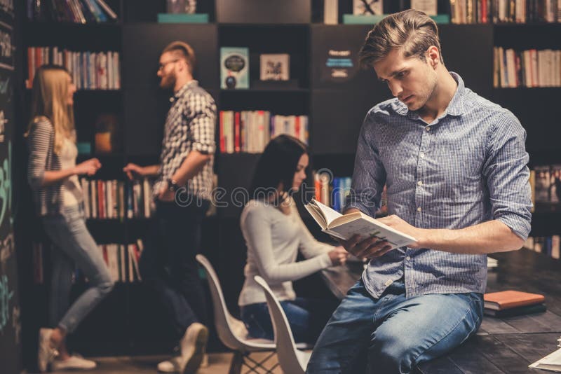 People in library aisle stock image. Image of academic - 20307361