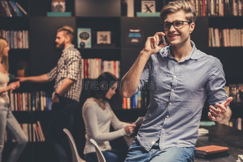 People in library aisle stock image. Image of academic - 20307361