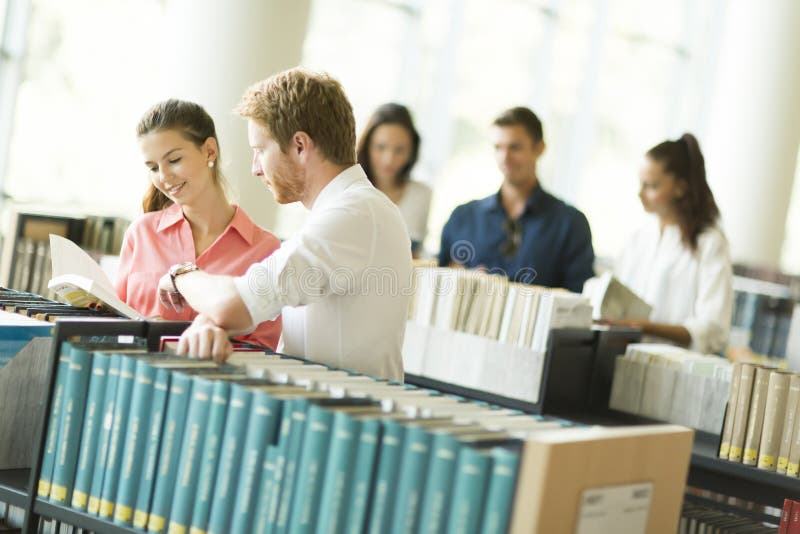 Young people in library stock image. Image of choice - 73284683