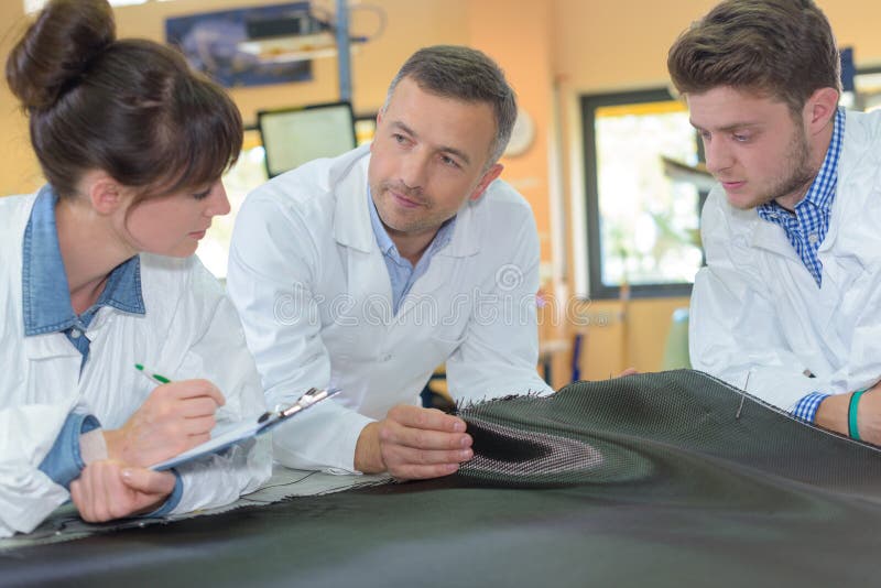 Young People Looking at Material Taking Notes on Clipboard Stock Image ...